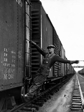 'Railroad Brakeman George Christian, Swinging His Arm Horizontally to ...