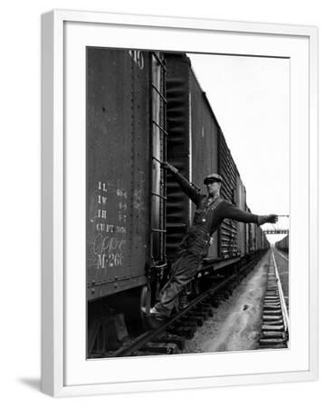 'Railroad Brakeman George Christian, Swinging His Arm Horizontally to ...