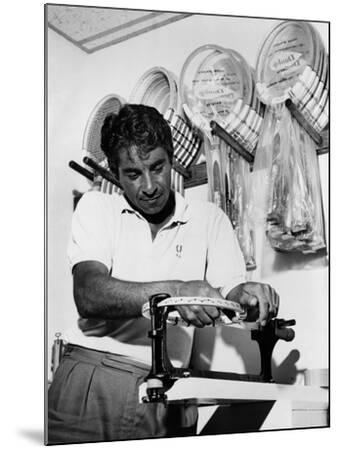 Richard 'Pancho' Gonzales Restringing a Tennis Racket in 1962 Mounted ...