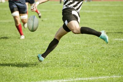 'Rugby Player Legs Kicking the Oval Ball' Photographic Print - melis ...