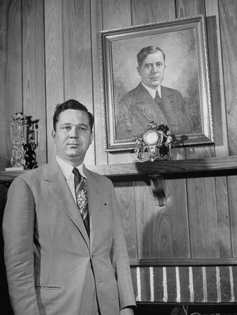 'Russell B. Long Standing Beneath a Portrait of His Father, Huey P ...