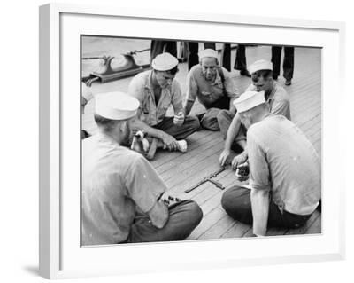 'Sailors Aboard a Us Navy Cruiser at Sea Playing a Game of Dominoes on ...