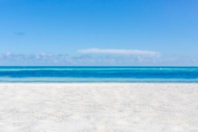 'Sea sand sky concept. Closeup of sand on beach and blue summer sky ...