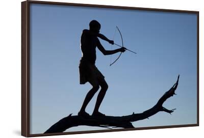 'Silhouette of Bushman with Bow and Arrow Balanced on Branch, Namibia ...