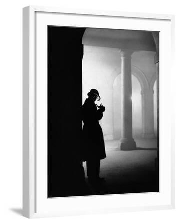 'Silhouette of Man Lighting Pipe' Photographic Print | AllPosters.com