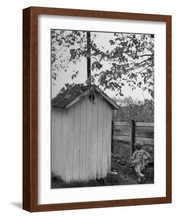 'Small Child Running to the Outhouse at Rural School' Photographic ...