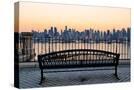 'Bench in Park and New York City Midtown Manhattan at Sunset with ...
