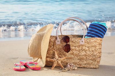 'Summer Beach Bag with Straw Hat,Towel,Sunglasses and Flip Flops on ...