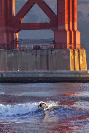 'Surfing under the Golden Gate Bridge, San Francisco, California, USA ...