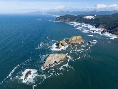 'The cold Pacific Ocean washes against the rugged and scenic northern ...