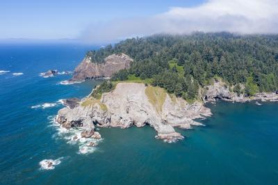The cold water of the Pacific Ocean meets the rugged yet beautiful ...