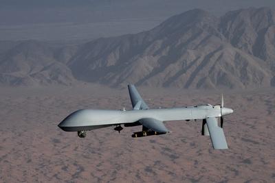 'The Predator Drone Carrying Hellfire Missiles in Flight, Dec. 16, 2008 ...