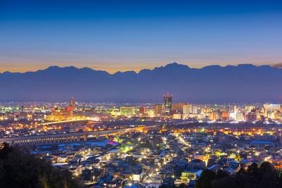 Toyama, Japan downtown city skyline with Tateyama Mountain at dawn ...