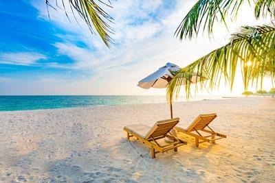 Tropical beach sunset background as summer landscape with lounge chairs ...