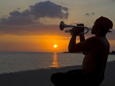 'Trumpet Player at Sunset, Playa Ancon, Trinidad, Cuba, West Indies ...