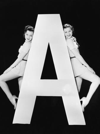 Two Women with Huge Letter A Photo | AllPosters.com