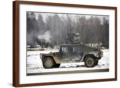 'U.S. Army Paratrooper Fires an M2 .50-Caliber Machine Gun Atop a ...