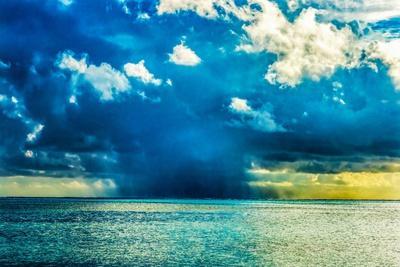 Rain storm cloud, Moorea, Tahiti, French Polynesia. Blue colors in ...