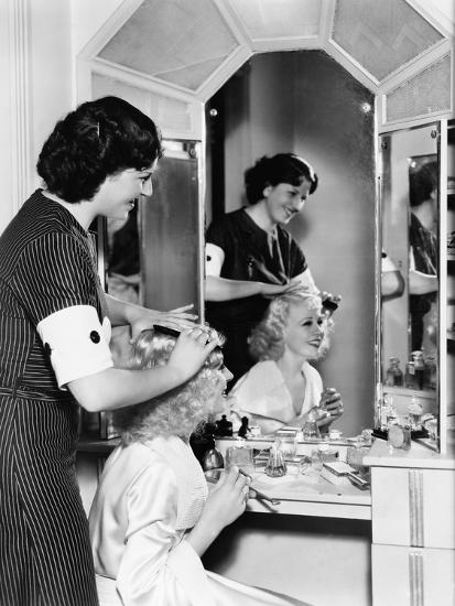 Woman Combing Another Womans Hair Photo