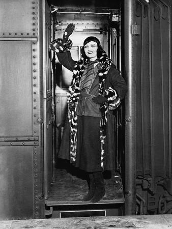 Woman on Jet Way Waving Goodbye Photo | AllPosters.com