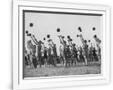 Women's Gym Class with Rows of Women Throwing Balls Into Air in Unison ...