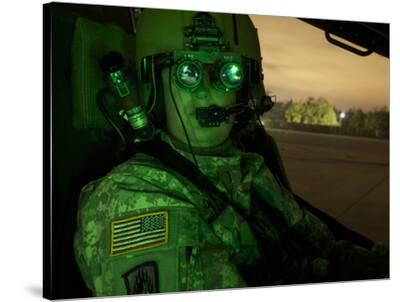 'Pilot Equipped with Night Vision Goggles in the Cockpit of An Apache ...