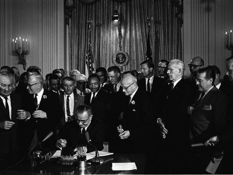 President Lyndon Johnson, Watched by Martin Luther King, Jr. Signing ...