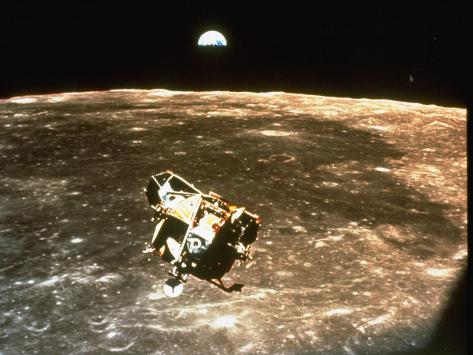 'Apollo 11's Lunar Module Flying over the Moon with Earth in the Bkgrd ...