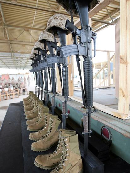 'Boots, Rifles, Dog Tags, And Protective Helmets Stand in Solitude To ...
