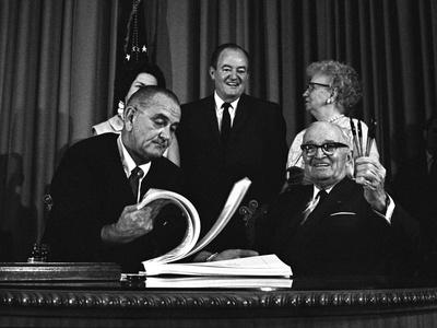 Lyndon Johnson Signing the Medicare Bill with Former President Truman ...