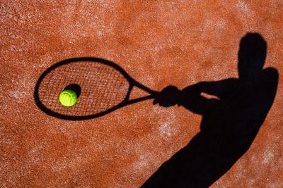 Shadow Of A Tennis Player In Action On A Tennis Court (Conceptual Image ...